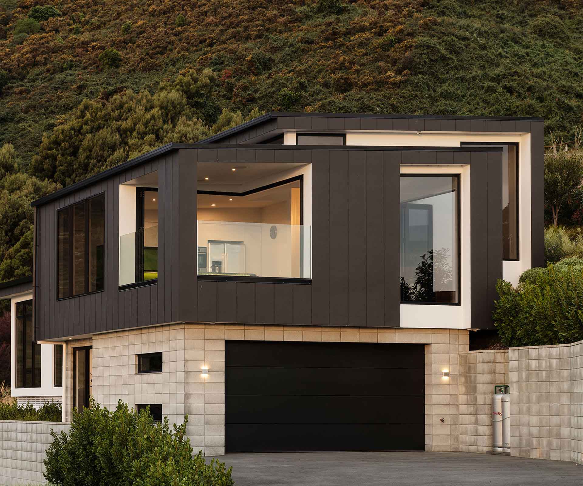 This chic black-clad home in Nelson was designed to soak up the view