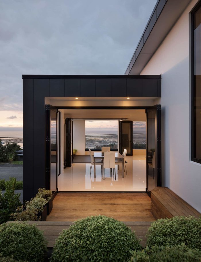 This chic black-clad home in Nelson was designed to soak up the view